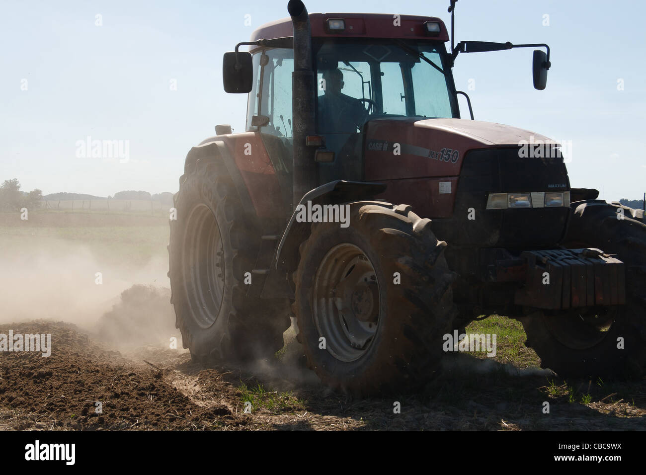 Tractor ploughing field. Western Poland Stock Photo - Alamy