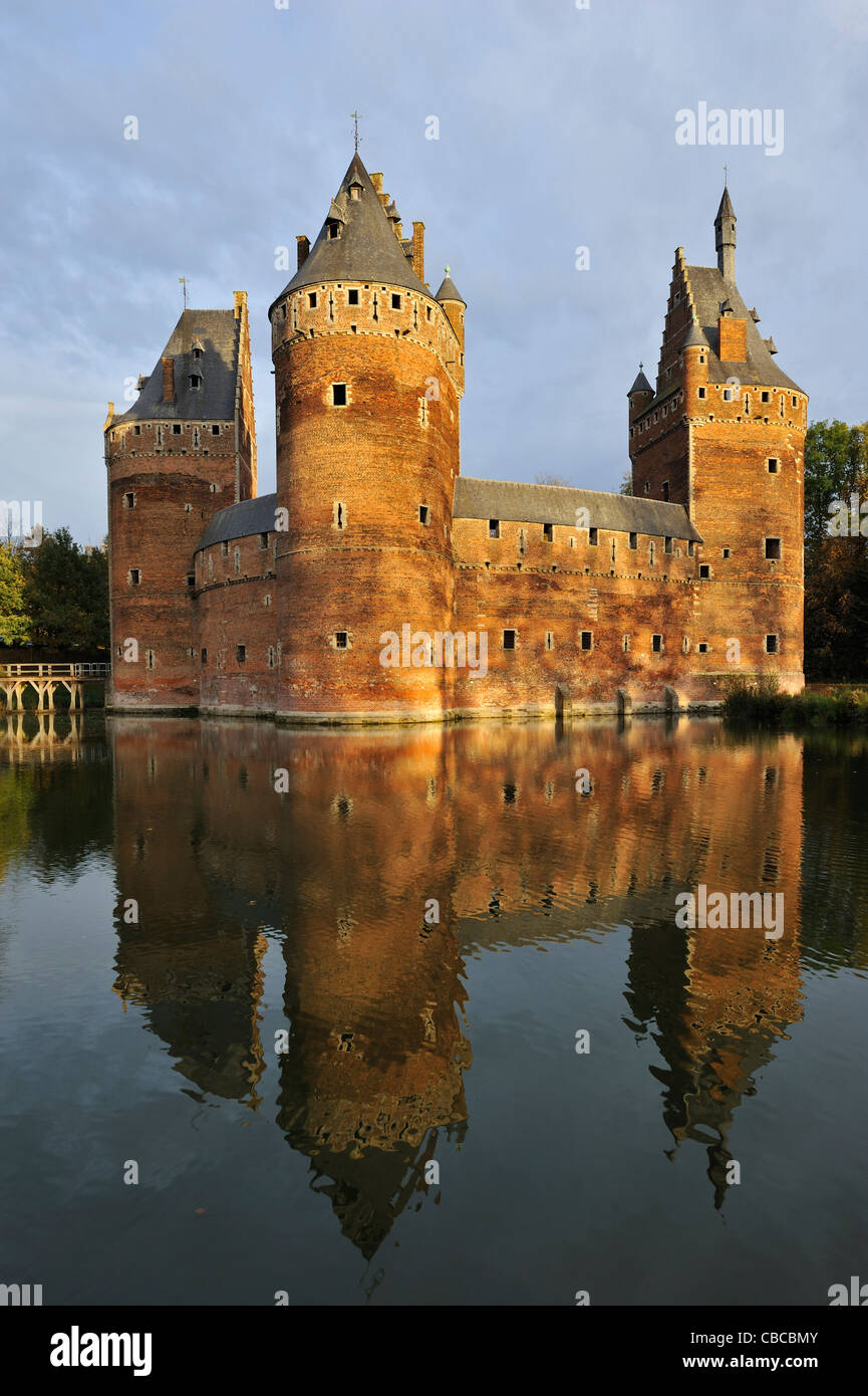 The medieval Beersel Castle reflected in moat at sunset, Belgium Stock ...