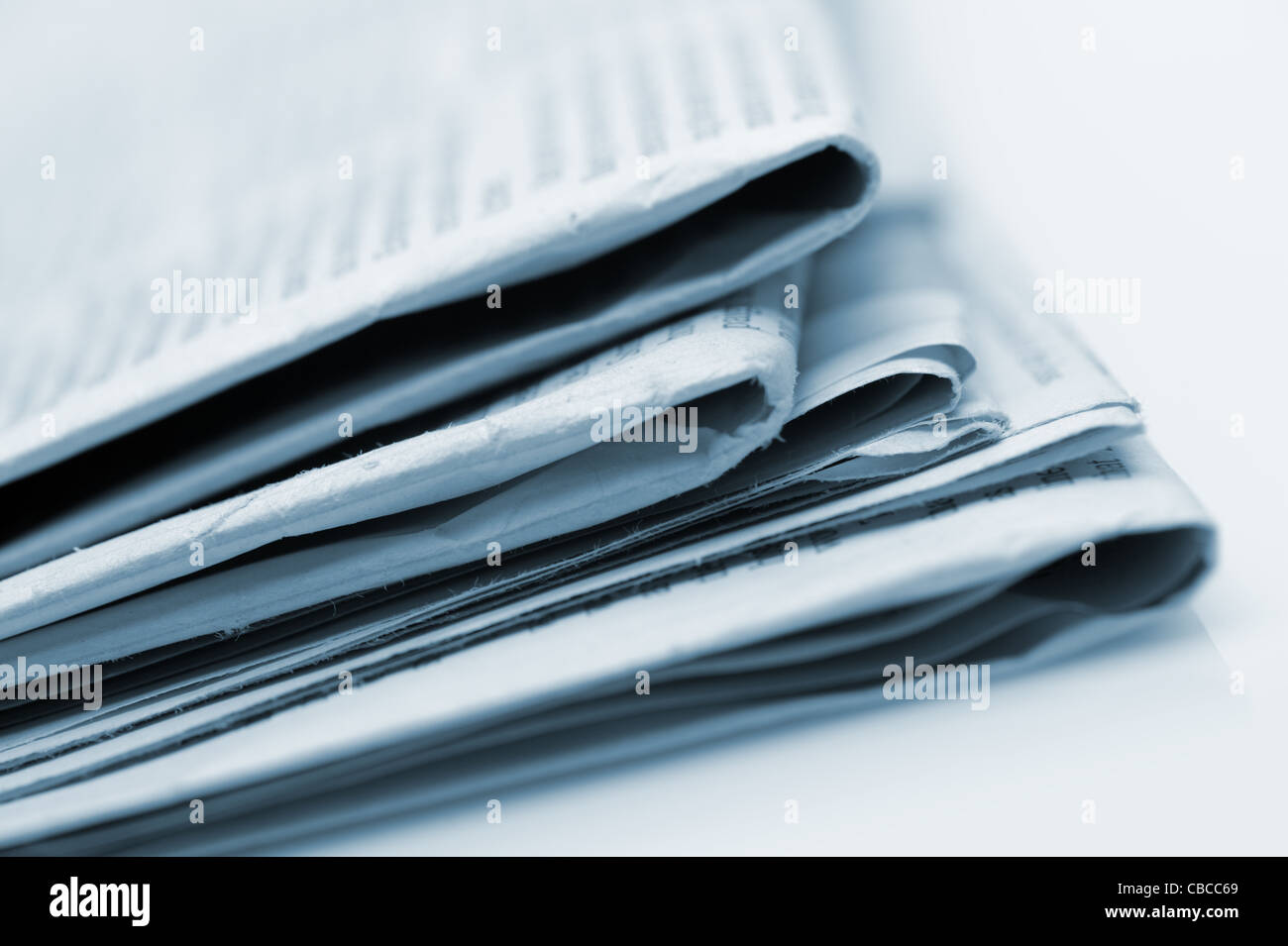 Pile of newspapers blue background hi-res stock photography and images ...