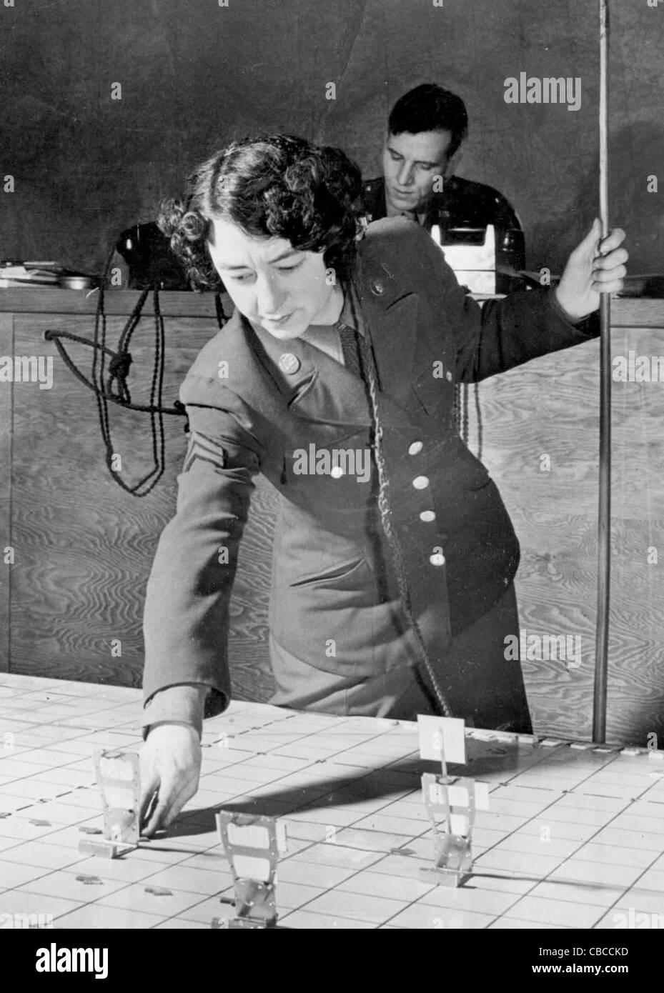 A USAAF Air WAC (Womens Army Corps) plotter at work in an operations ...