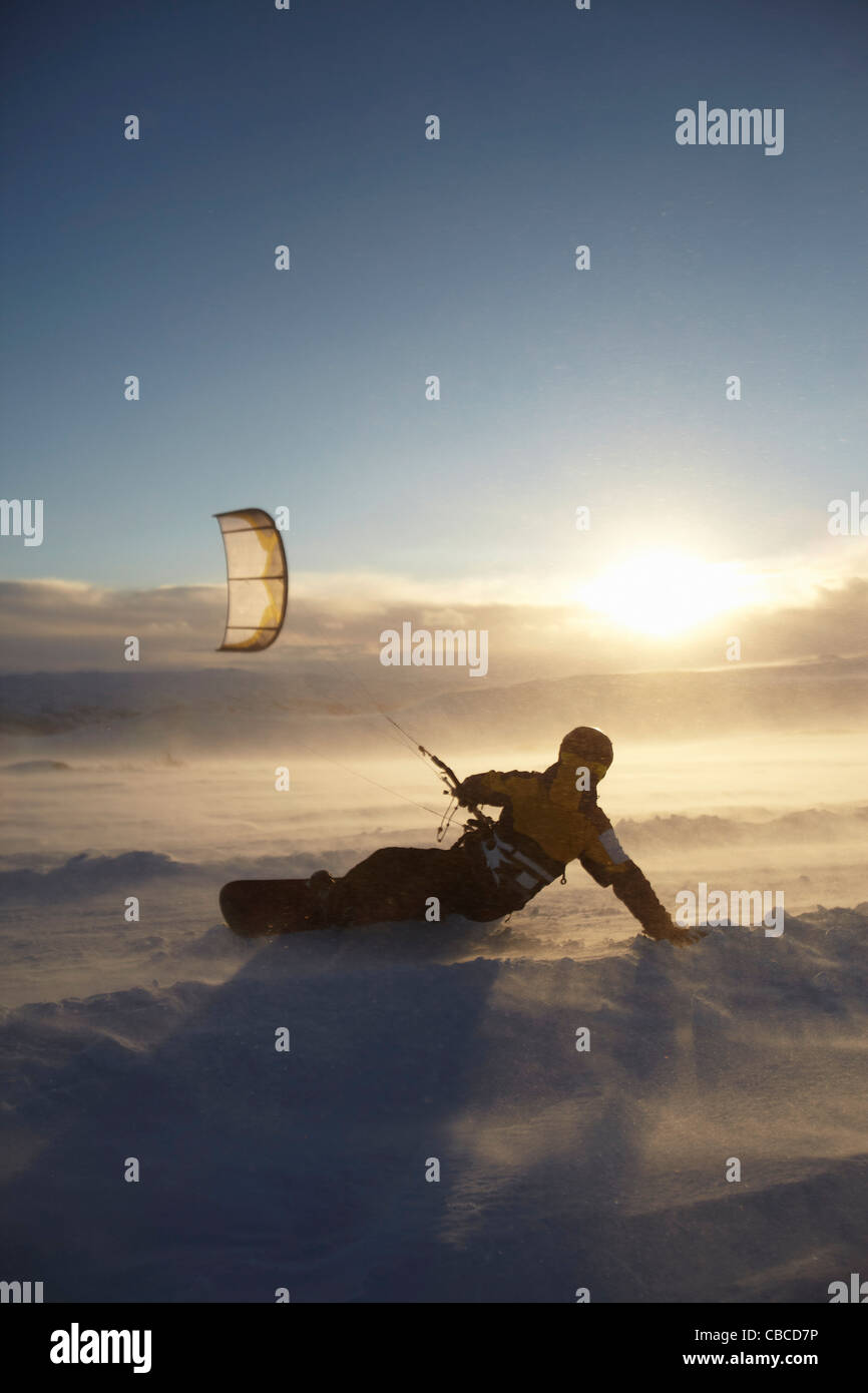 Man windsurfing on snowboard Stock Photo - Alamy