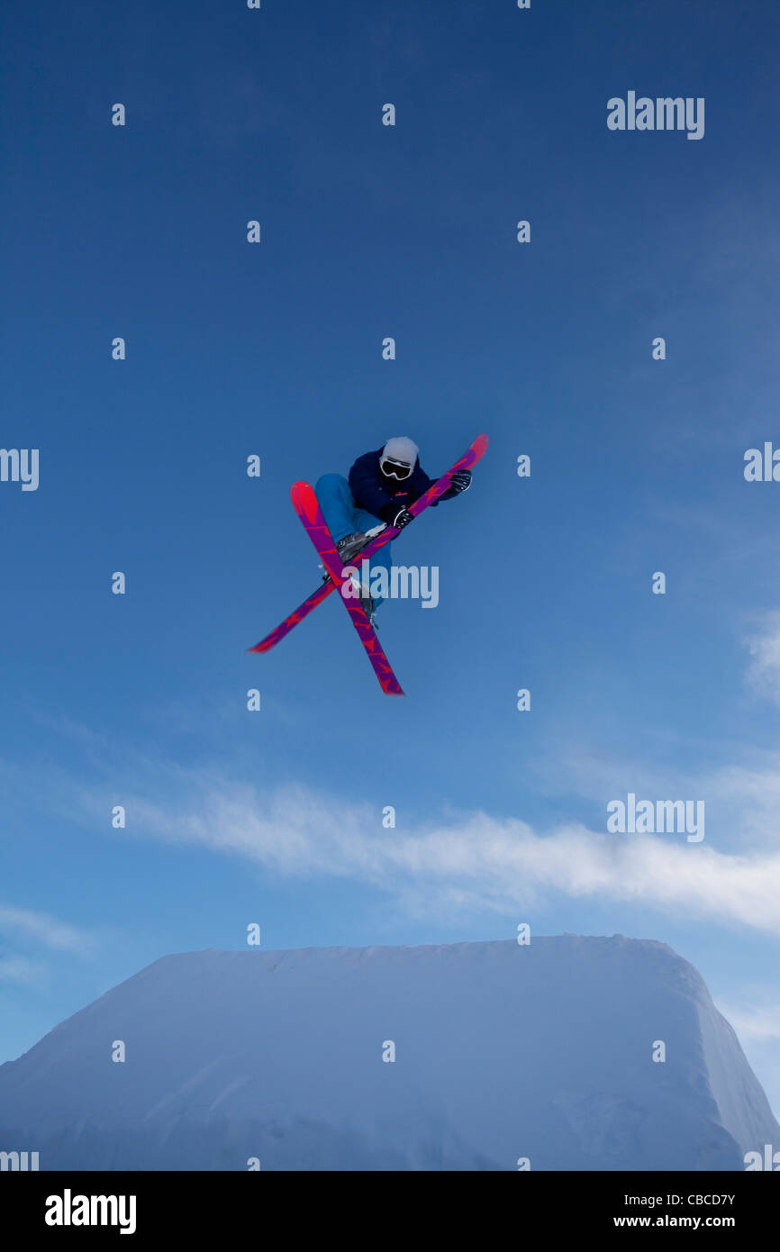 Skier crossing skis in the air Stock Photo - Alamy