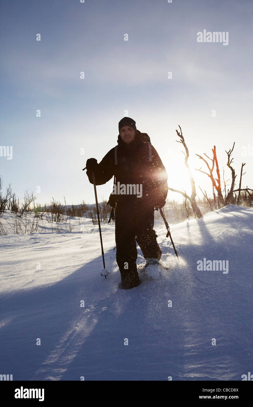 Cross-country skier walking in snow Stock Photo - Alamy