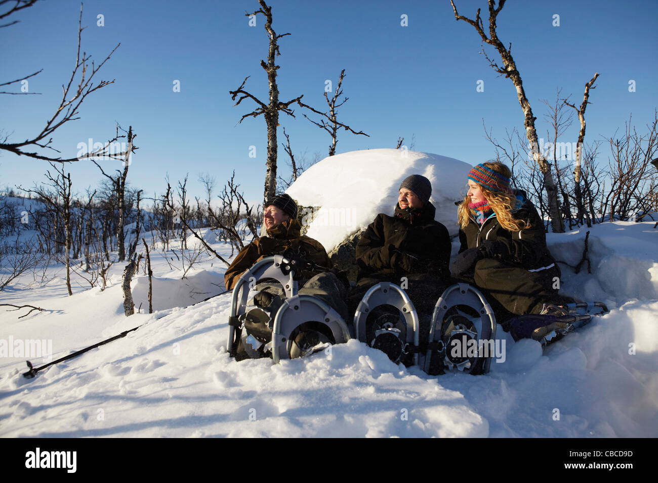 Cross-country skiers resting in snow Stock Photo - Alamy