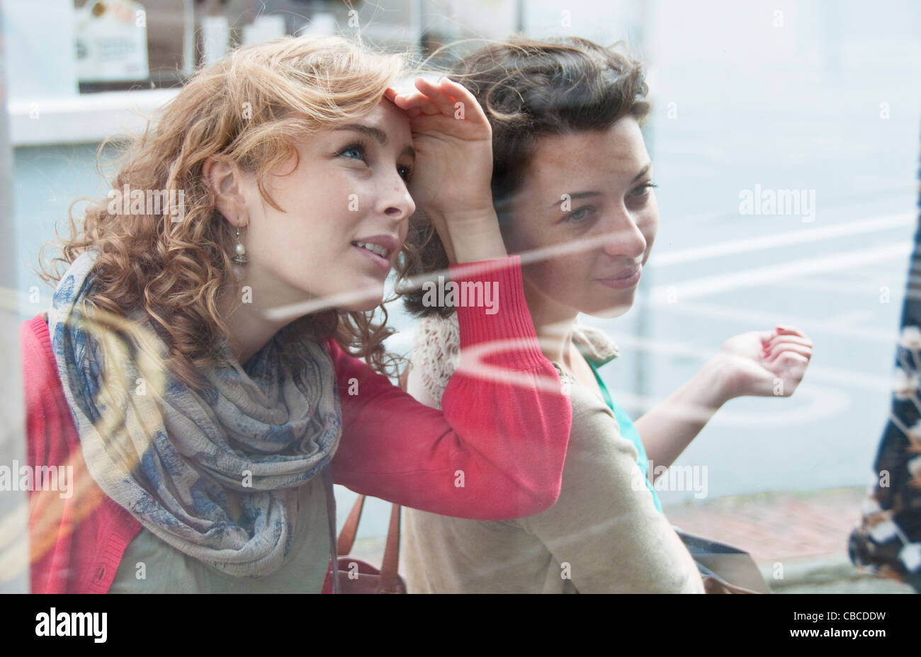 Teenage girls window shopping together Stock Photo - Alamy