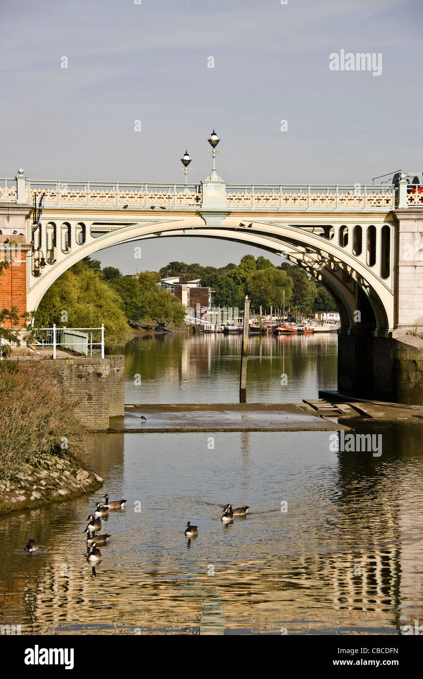 Grade 2 listed Richmond Lock Footbridge with view along Thames river ...