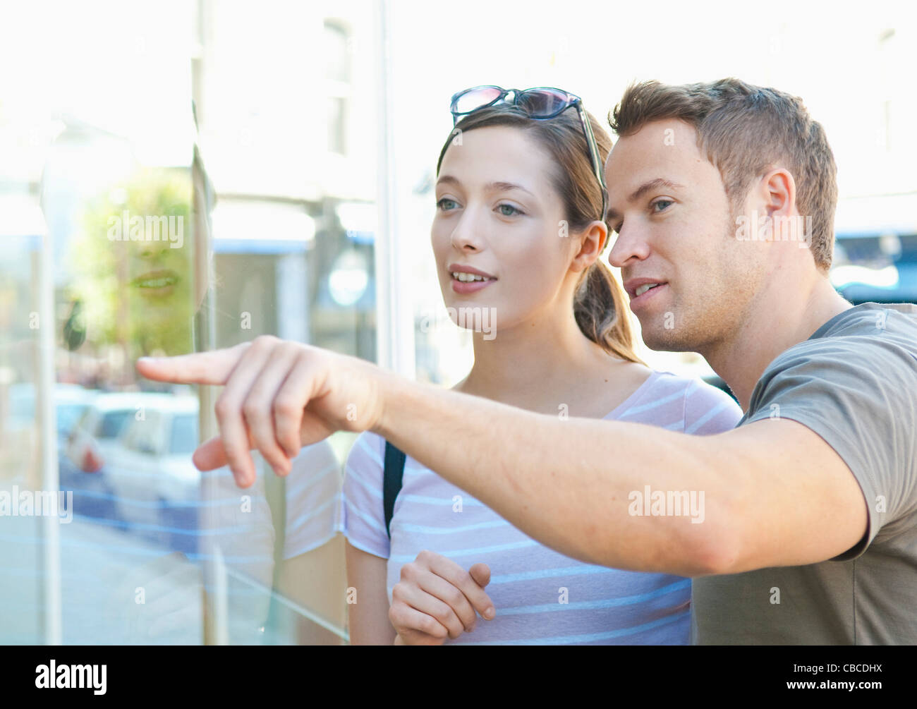 Couple window shopping together Stock Photo - Alamy