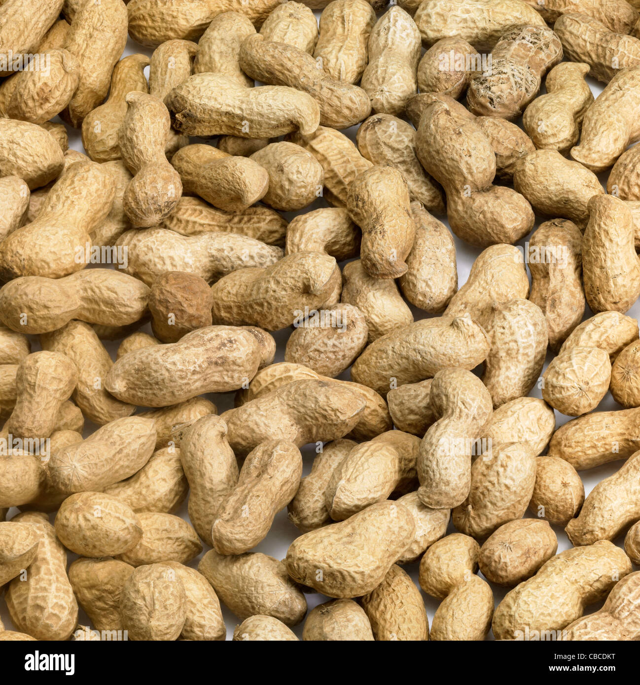 background showing lots of peanuts with paring Stock Photo - Alamy