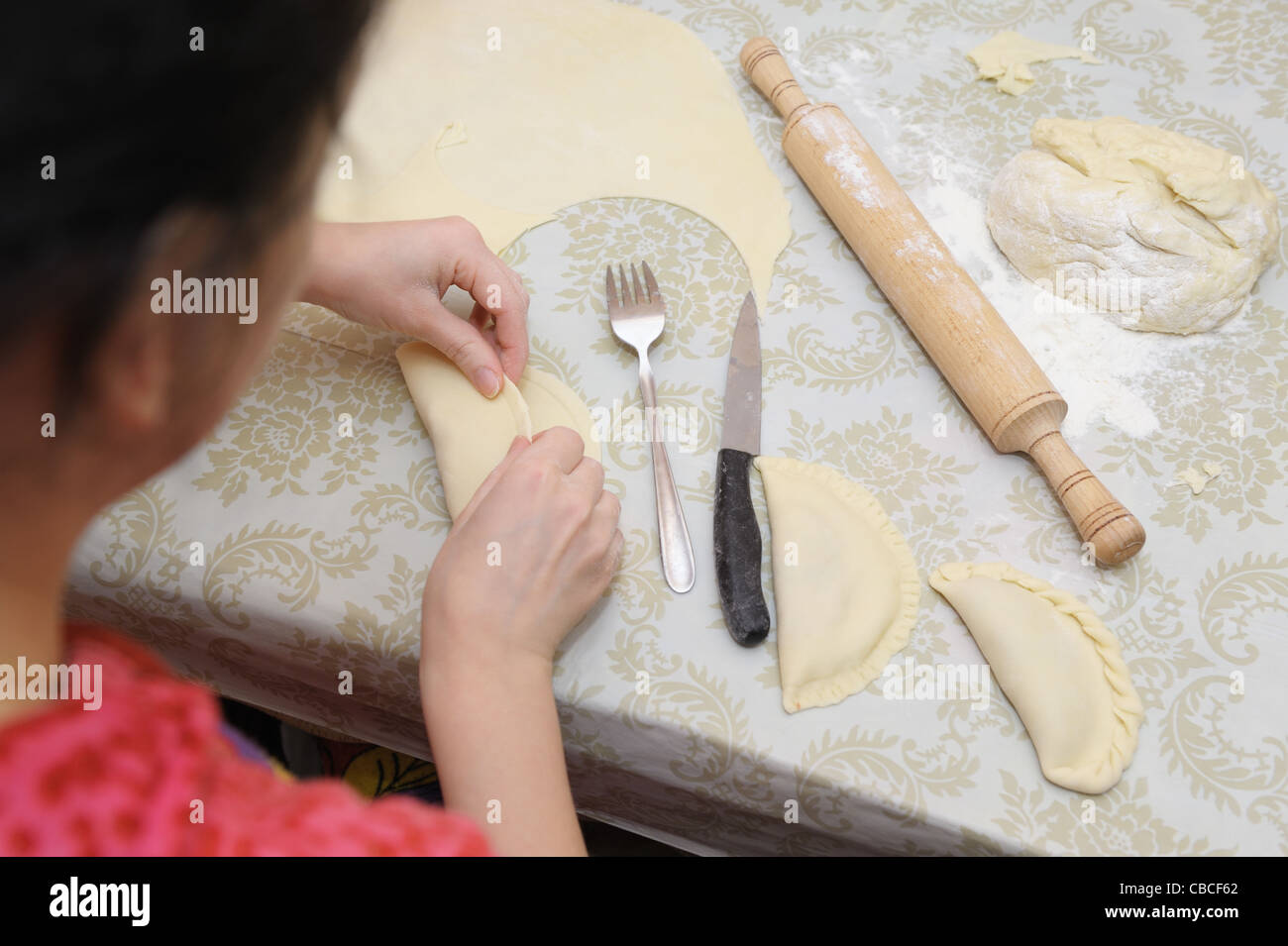 The woman prepares a pie. House conditions, cooking Stock Photo - Alamy