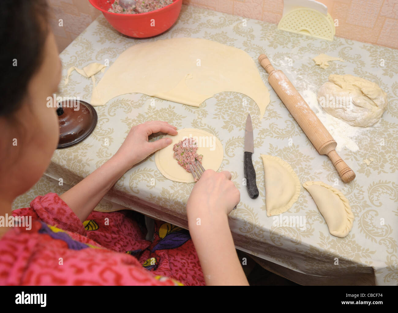 The woman prepares a pie. House conditions, cooking Stock Photo - Alamy