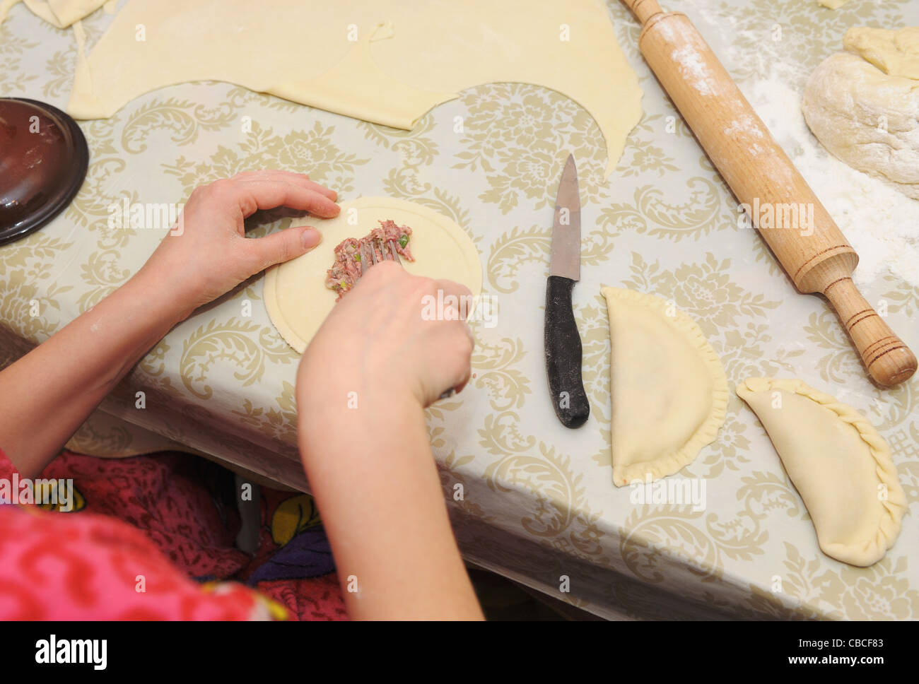 The woman prepares a pie. House conditions, cooking Stock Photo - Alamy