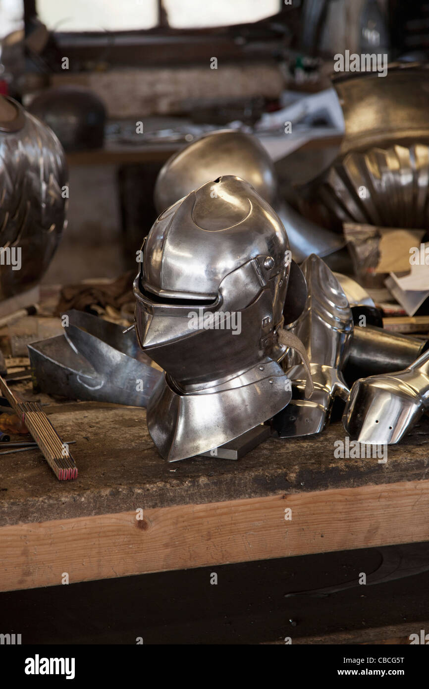 Metal helmet in blacksmith’s shop Stock Photo - Alamy