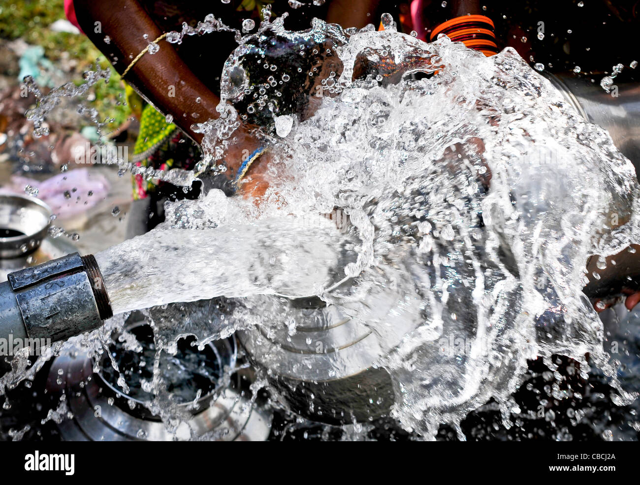 Women and children gather water from pumps in India Stock Photo - Alamy