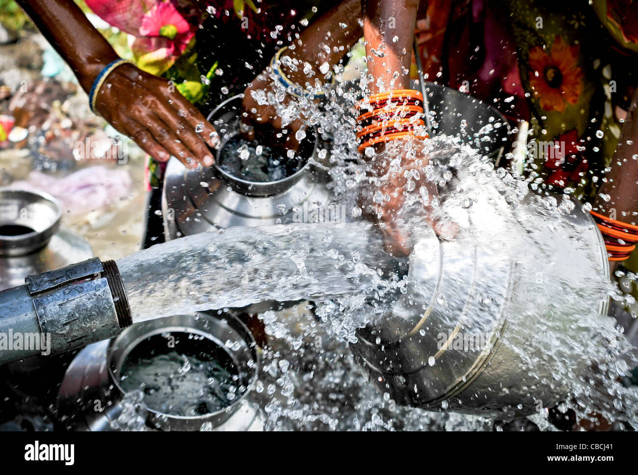 Women and children gather water from pumps in India Stock Photo - Alamy