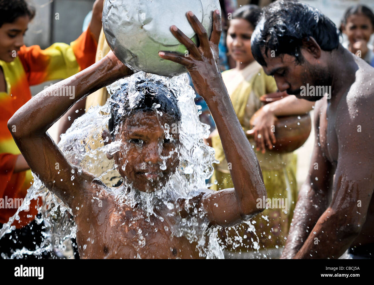 Women and children gather water from pumps in India Stock Photo - Alamy