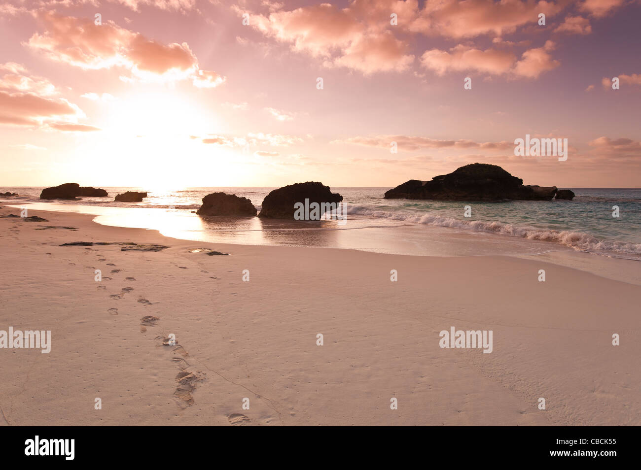 Bermuda. Sunrise and footprints footsteps on Horseshoe Bay beach ...