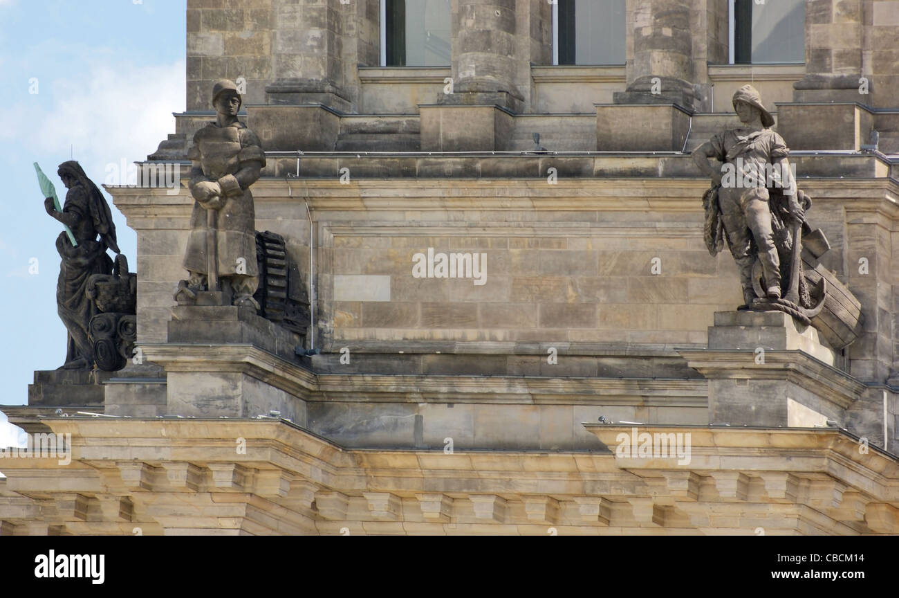 detail of the Reichstag in Berlin with some figures in sunny ambiance ...