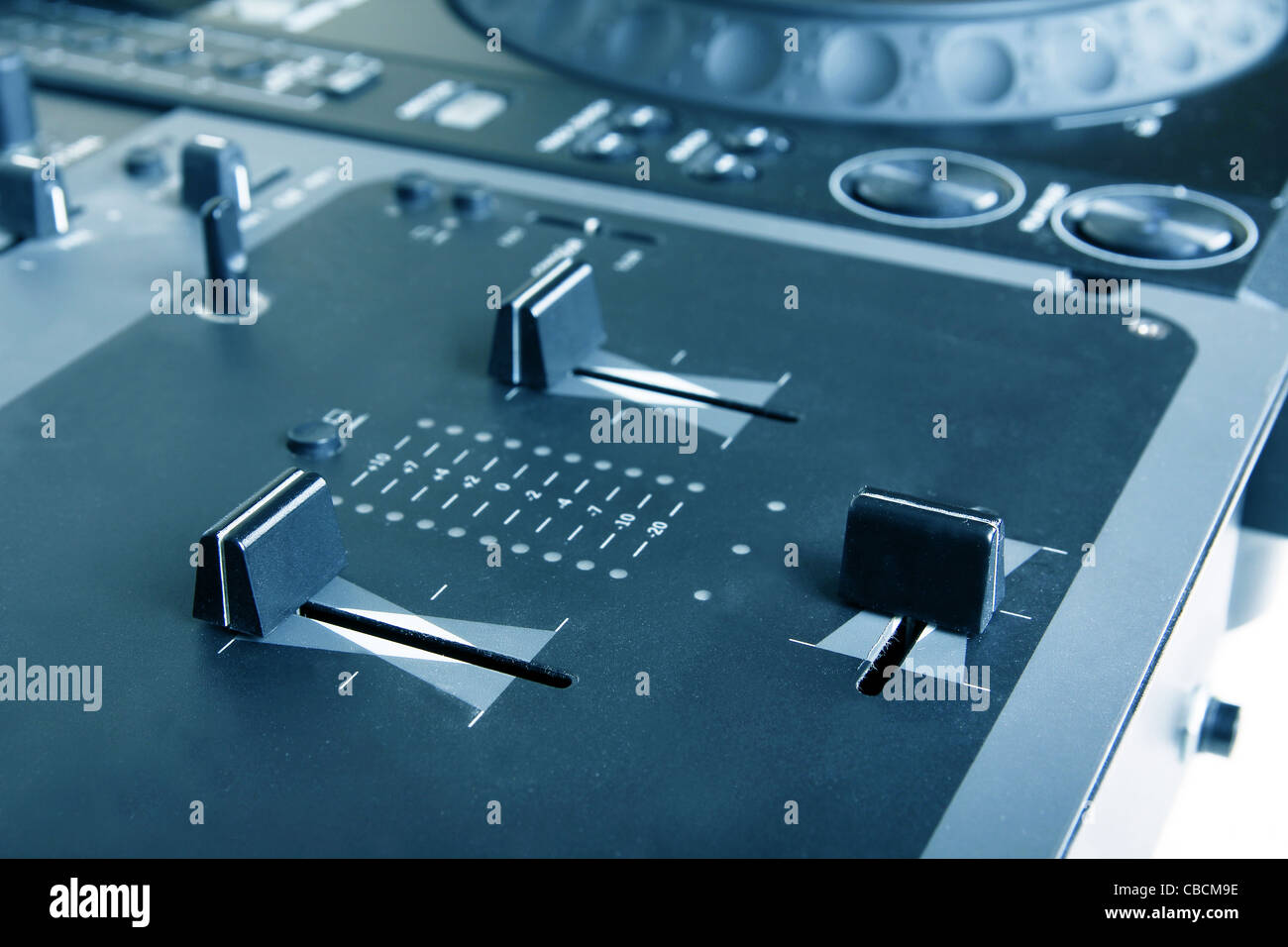 Dj mixer and cd player, closeup in blue tone Stock Photo - Alamy