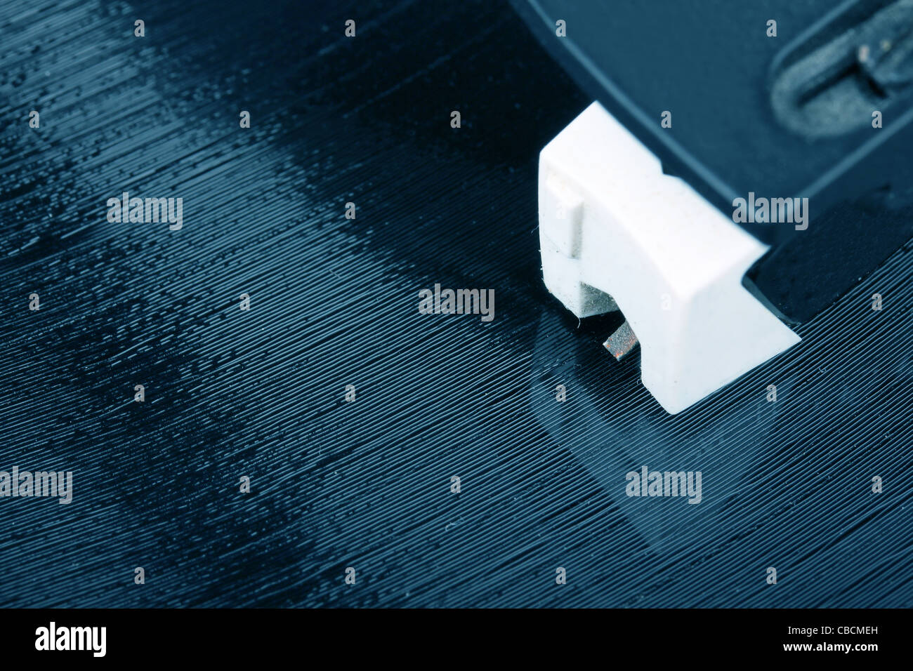 Dj needle on vinyl blue tones Stock Photo - Alamy