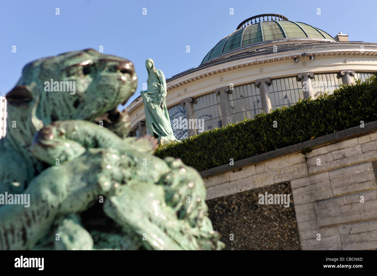 View of the Botanique museum in Brussels and statues of the park ...