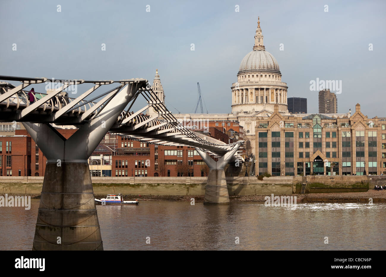 The Millennium footbridge with St. Paul's Cathedral's dome in the ...
