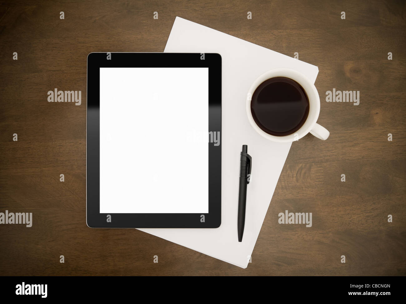 Contemporary digital tablet with blank screen lying on worktable with ...