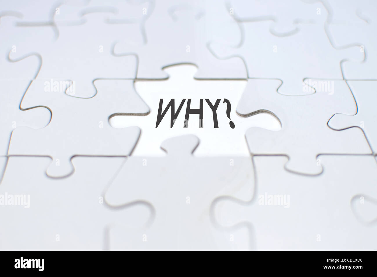 Missing jigsaw puzzle revealing the question why Stock Photo - Alamy