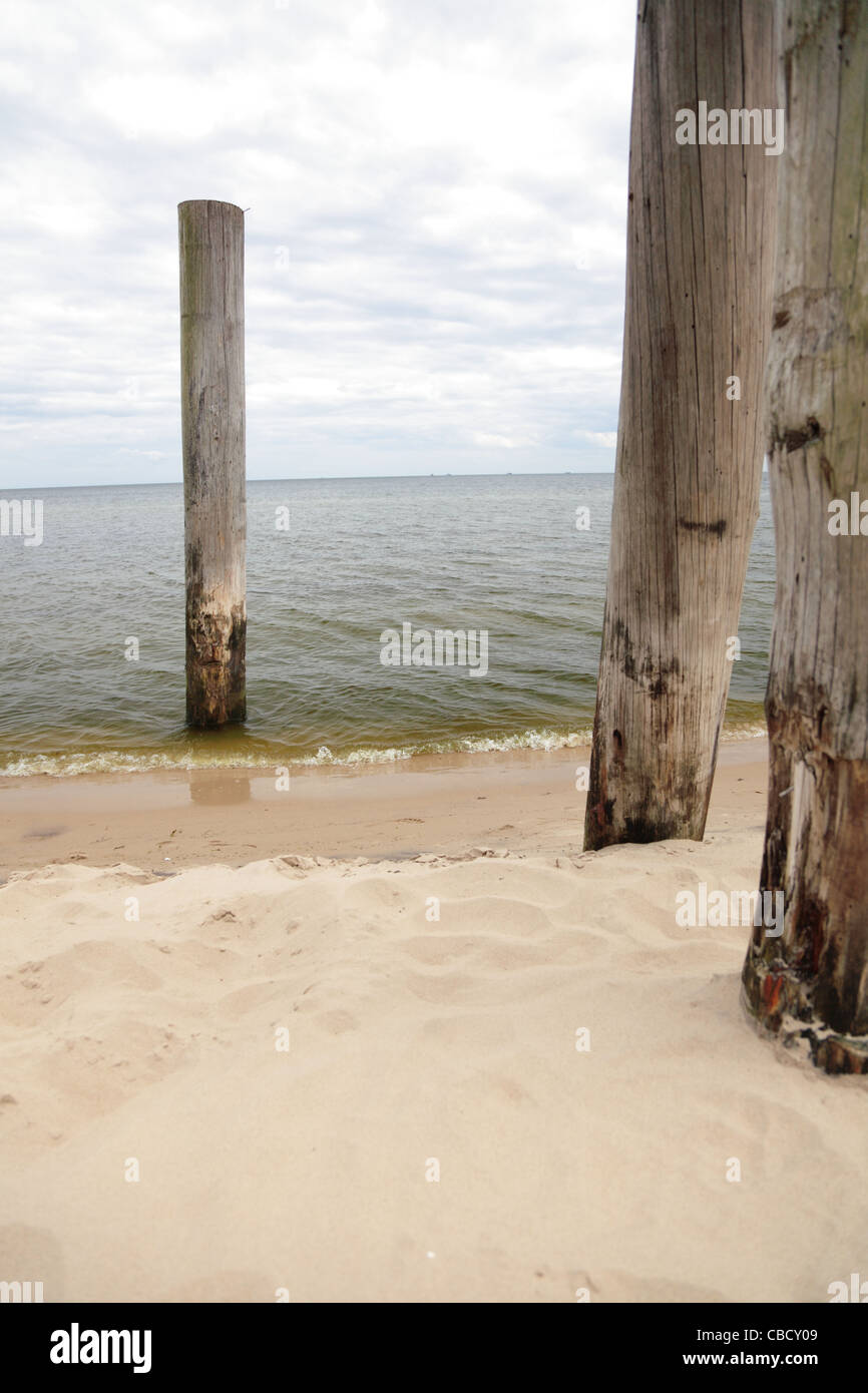rows of piles on the sea beach - outdoor Stock Photo - Alamy