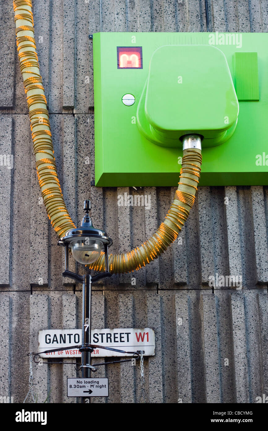 Giant Green Plug Mounted on a wall in London England Stock Photo - Alamy