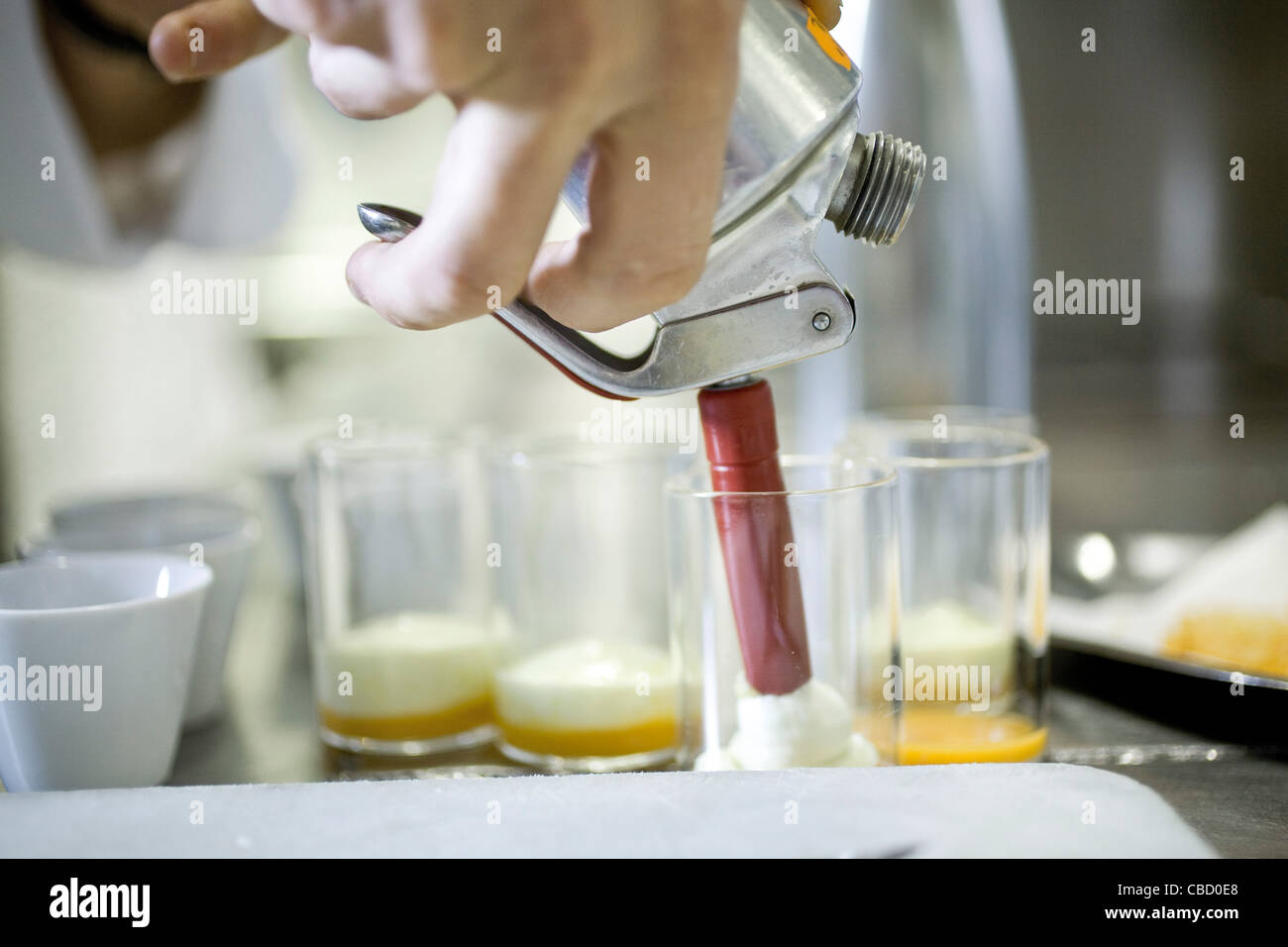Chef preparing appetizers commercial kitchen hi-res stock photography ...