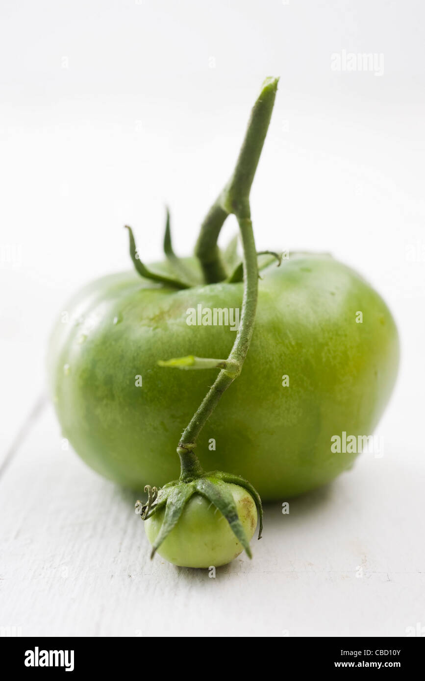 Two small green tomatoes hi-res stock photography and images - Alamy