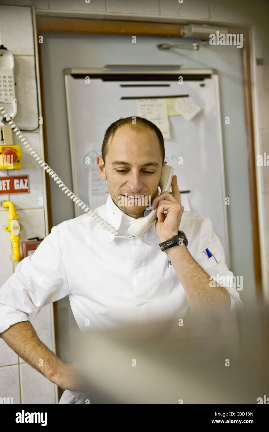 Chef talking on telephone Stock Photo - Alamy