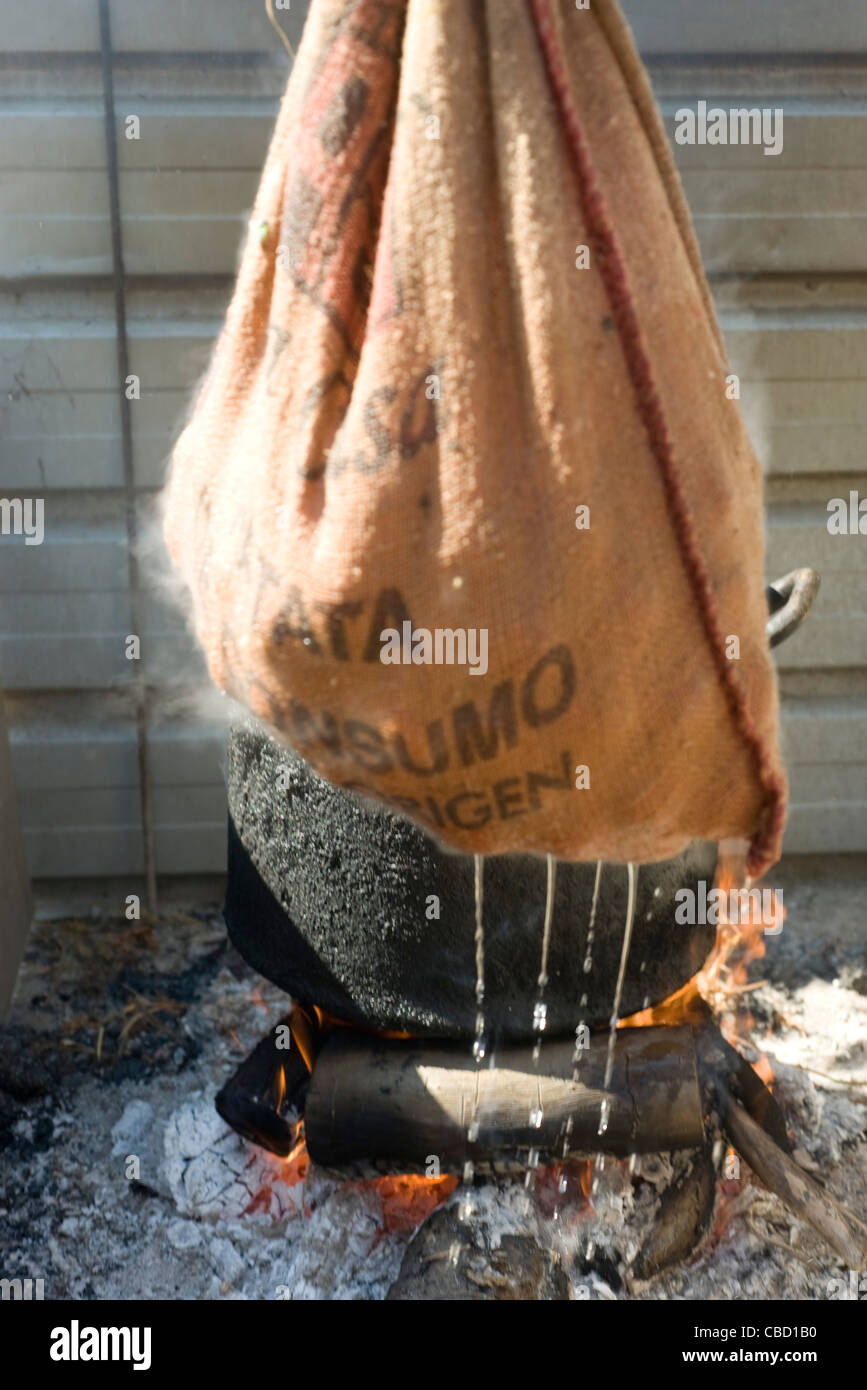 Burlap sack steaming over fire Stock Photo - Alamy