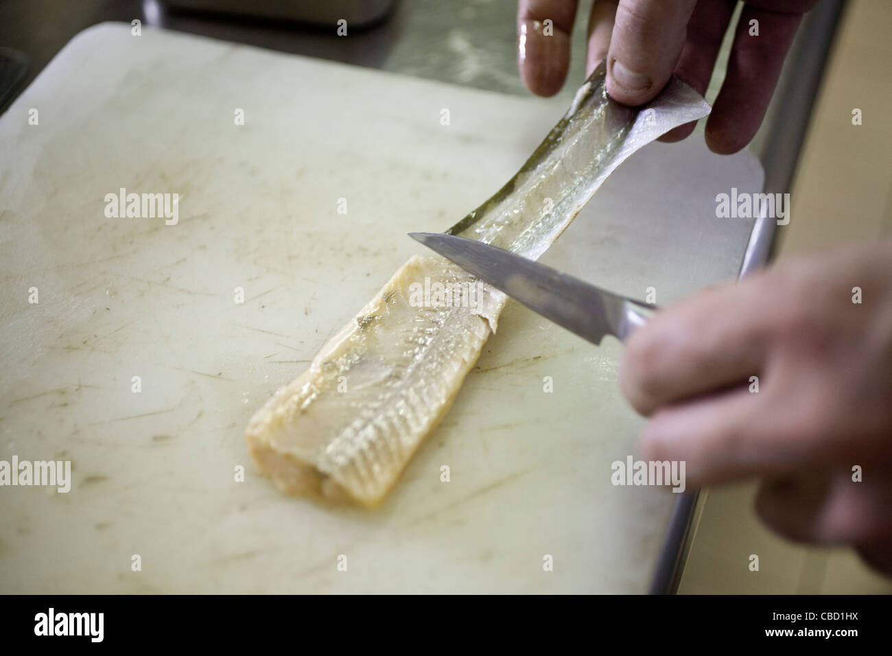 Removing skin from fish hi-res stock photography and images - Alamy