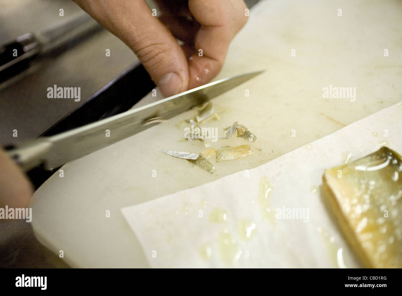 Cutting fish skin Stock Photo - Alamy