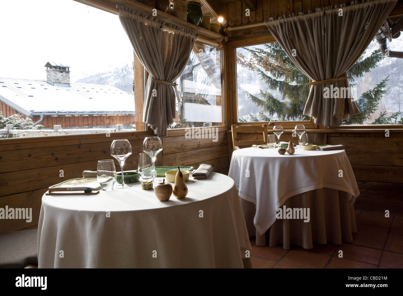 Nicely set tables by window Stock Photo - Alamy