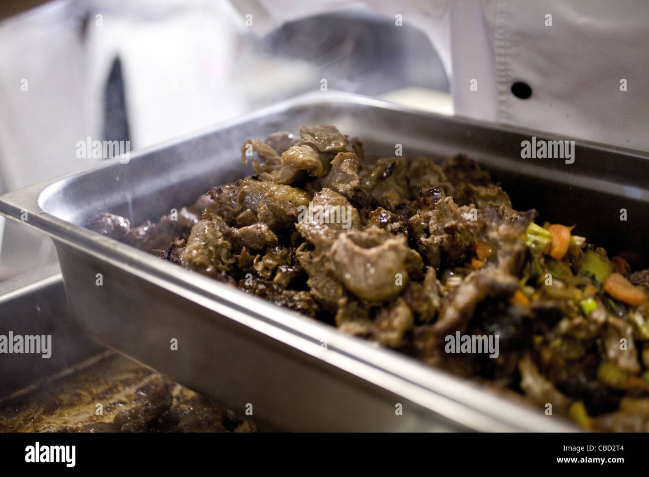 Meat cooking in dish Stock Photo - Alamy