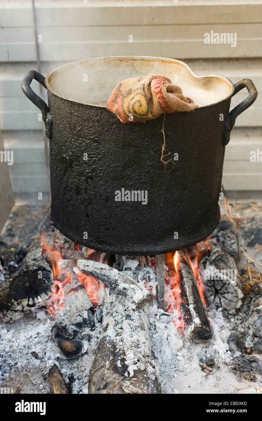 Pot cooking on fire Stock Photo - Alamy