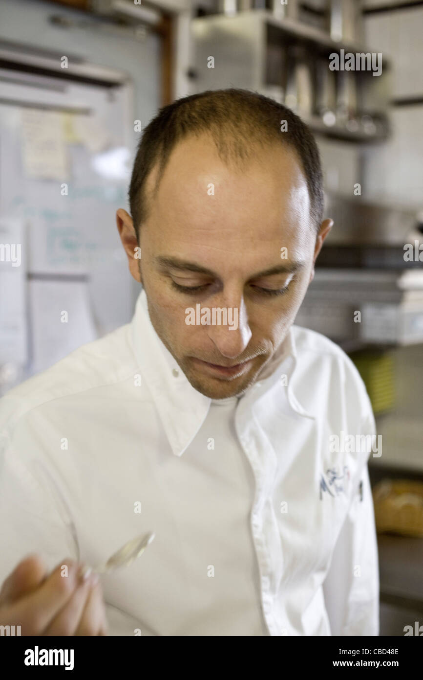 Chef holding spoon Stock Photo - Alamy