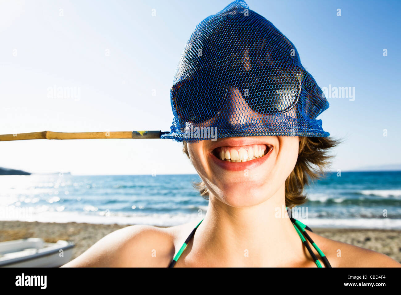 Woman fishing with net beach hi-res stock photography and images - Alamy