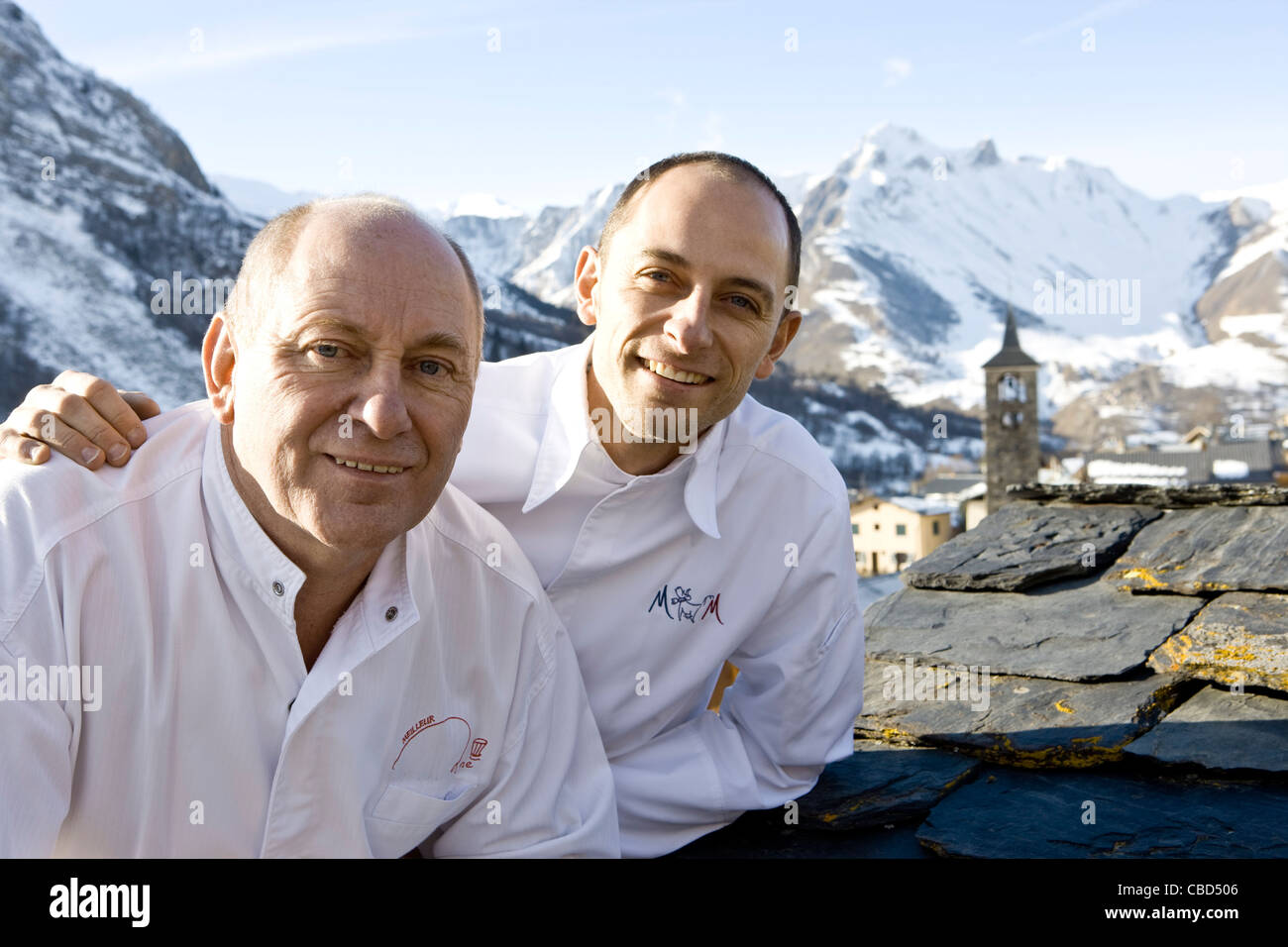 Father and son chef team at mountain resort, portrait Stock Photo - Alamy