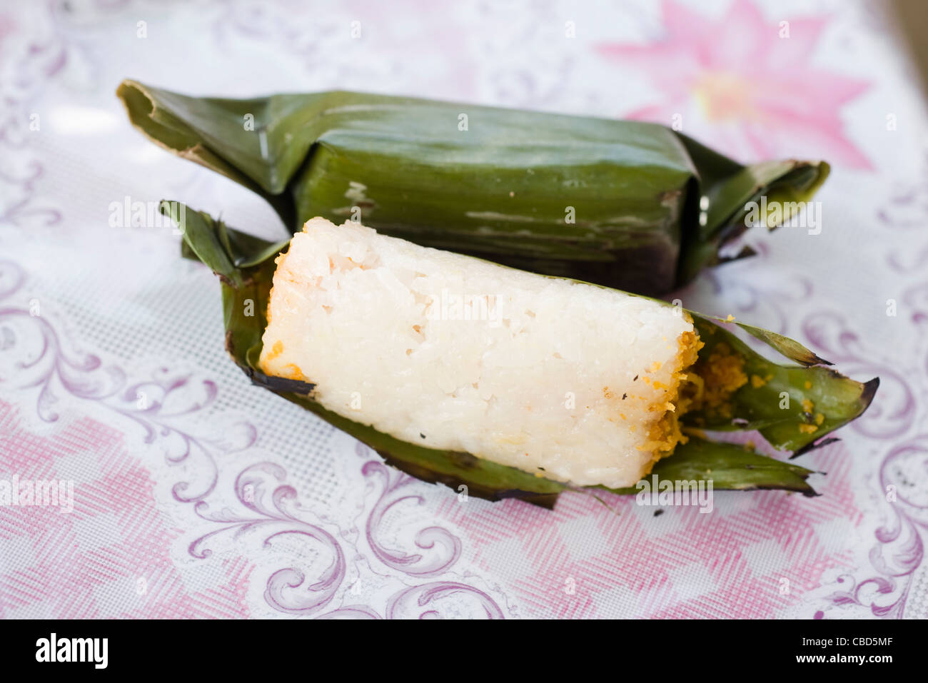 Pulut panggang, glutinous rice wrapped in pandan leaves Stock Photo - Alamy