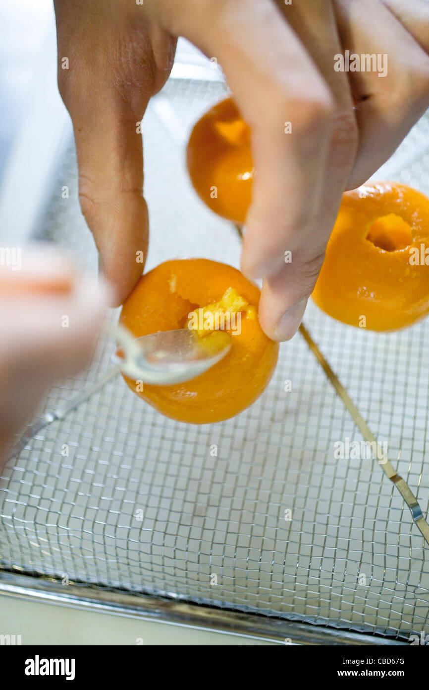 Preparing candied mandarin oranges Stock Photo - Alamy