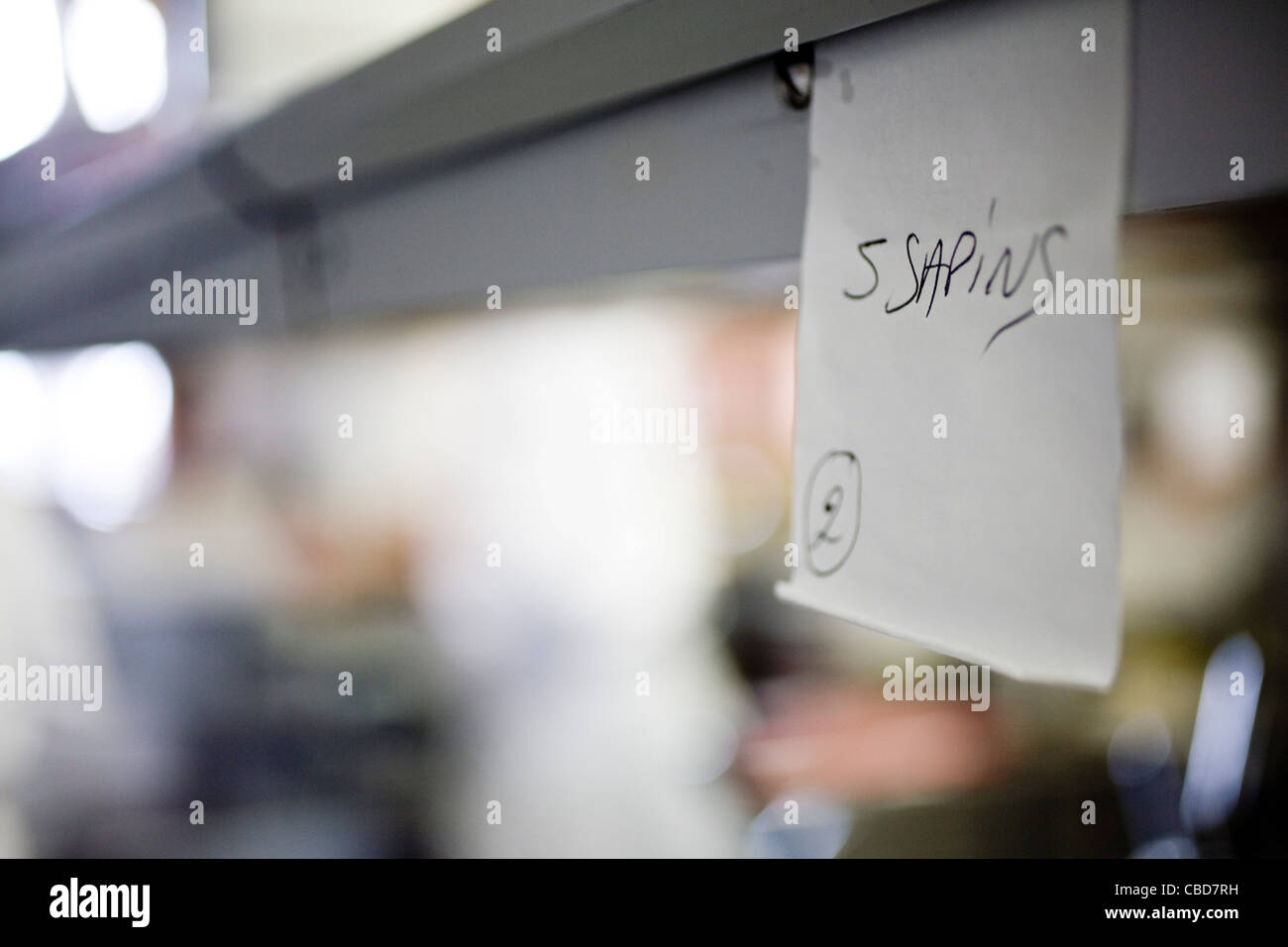 Written order posted in restaurant kitchen Stock Photo - Alamy