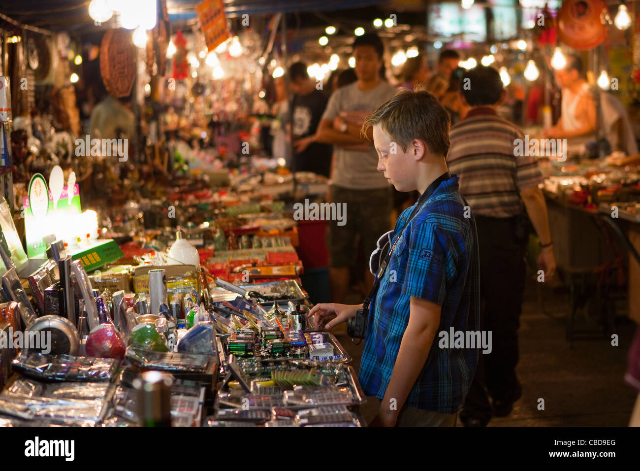 Young Boy shopping at Temple Street Night Market Stock Photo - Alamy