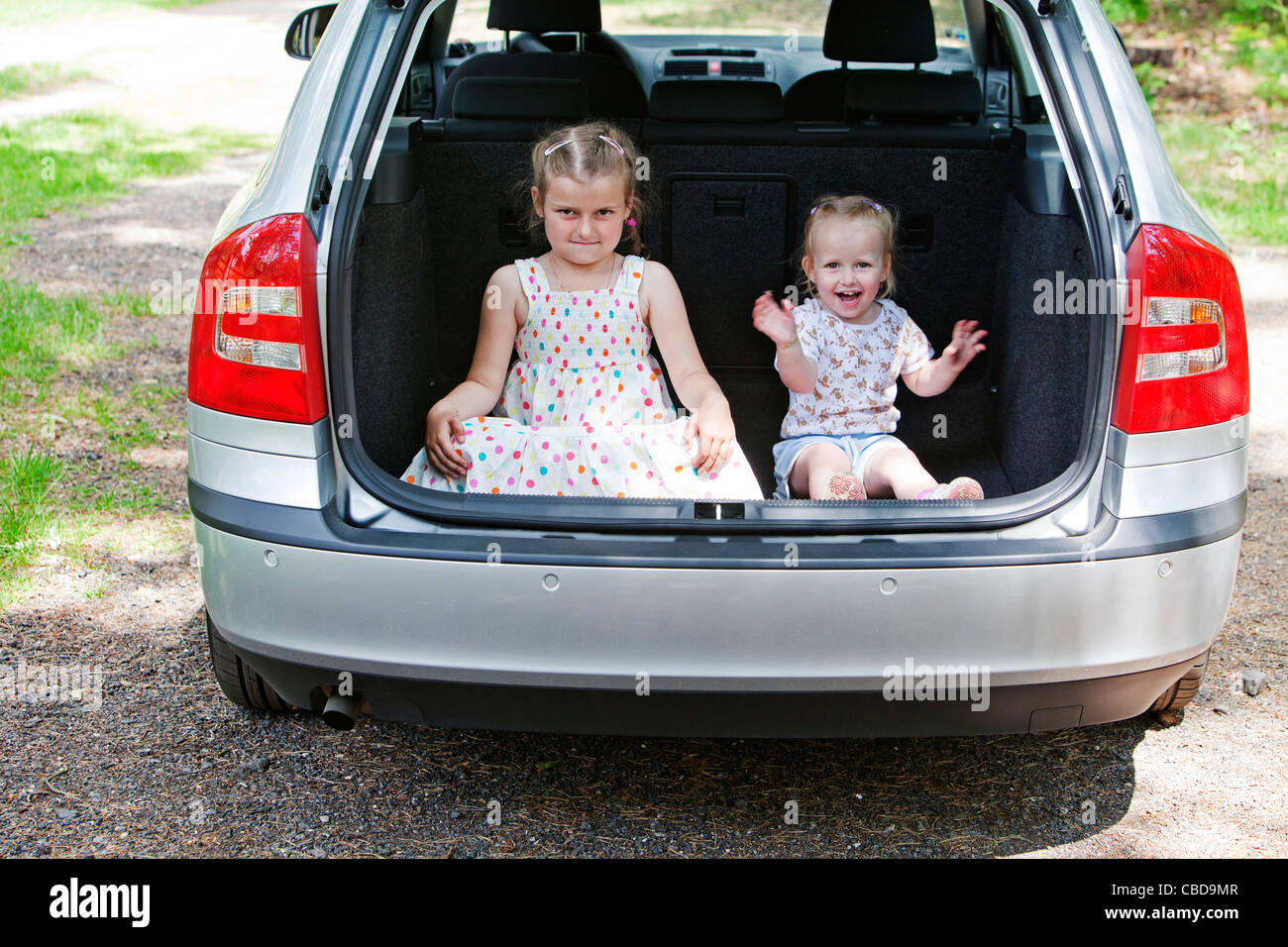 Girls on the family trip, children, kids, car boot (CTK Photobank ...