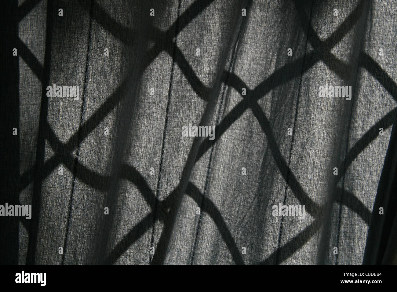curtains with window bars shadow Stock Photo - Alamy