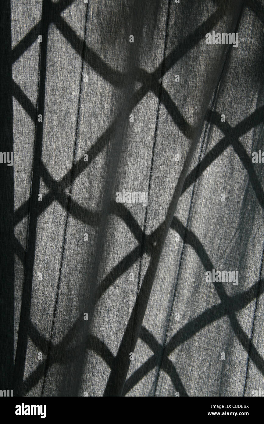 curtains with window bars shadow Stock Photo - Alamy