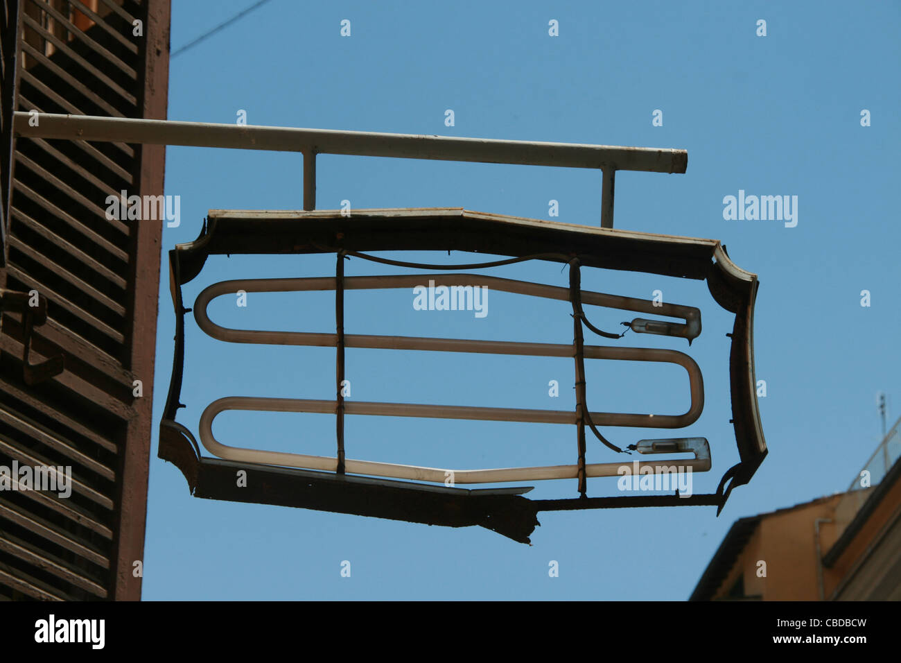 old damaged neon sign outside shop front in city town Stock Photo - Alamy