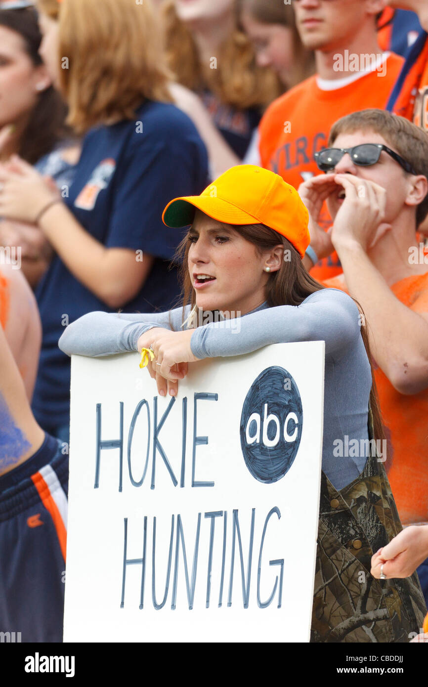 A female Virginia Cavaliers fan with a sign critical of the Virginia ...